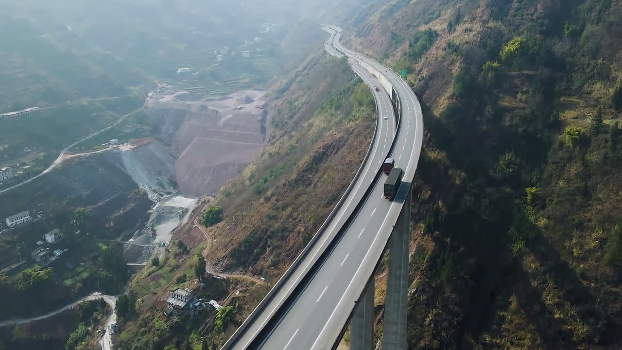 Side view of trucks cars vehicles passing double lane highway bridge in ...