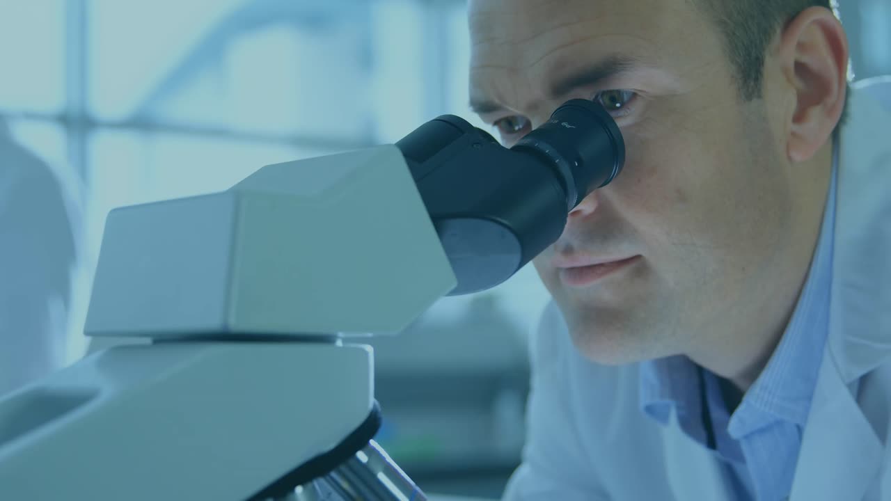 Animation of scopes scanning and data processing on screens over male ...