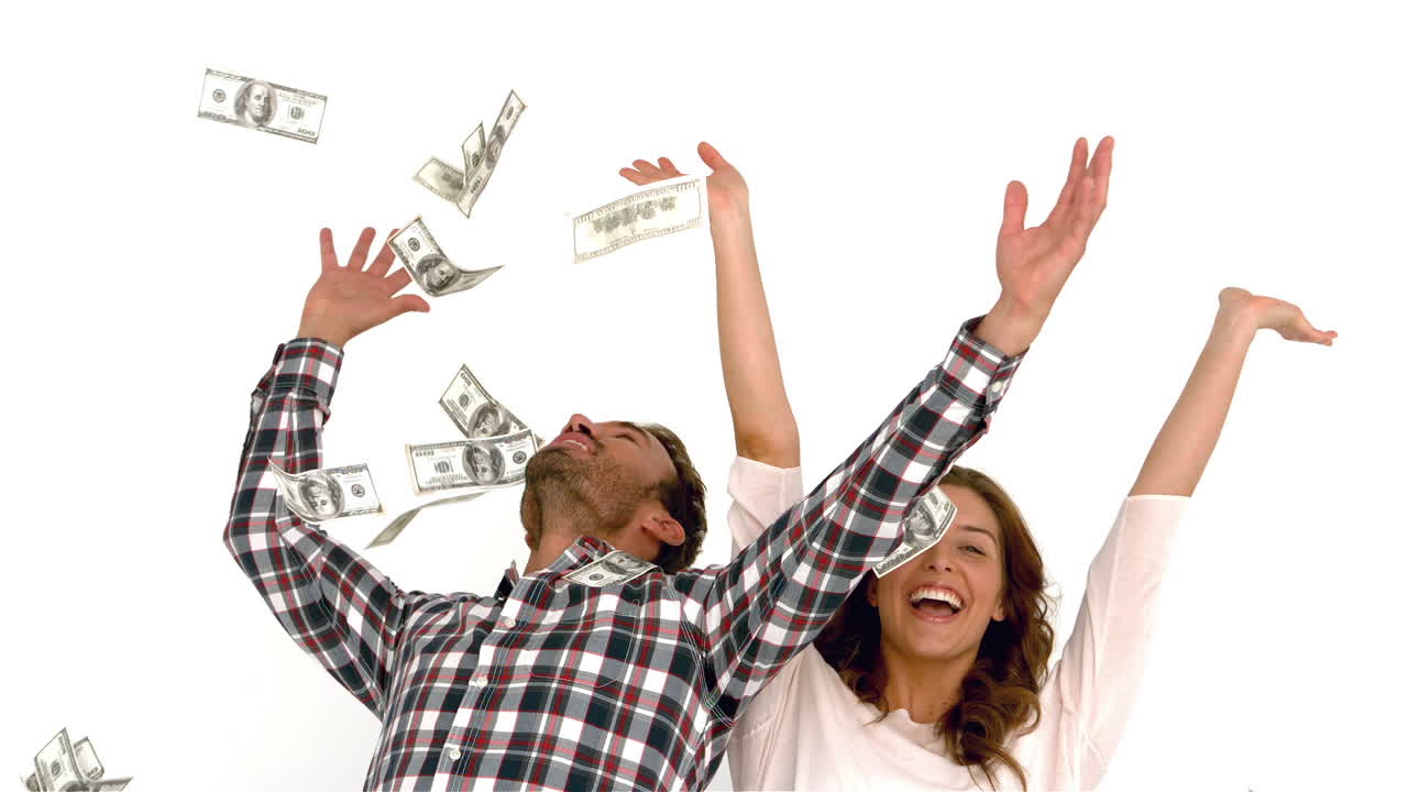 Premium stock video - Happy couple throwing money
