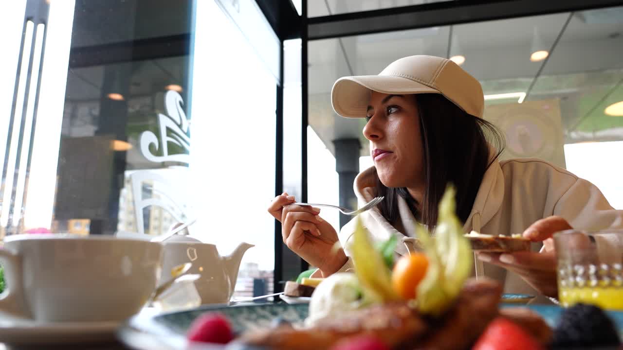 Premium stock video - Low angle of caucasian woman chew, swallow ...