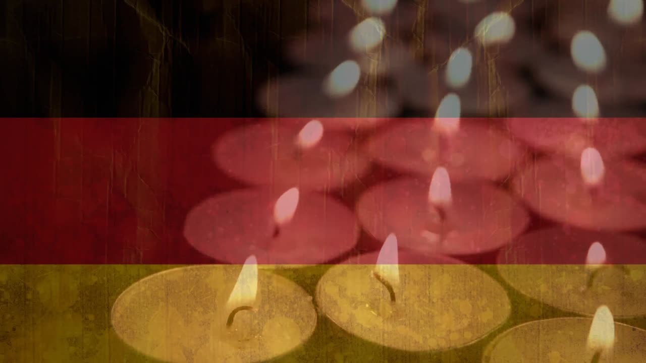 Premium stock video - German flag behind candles