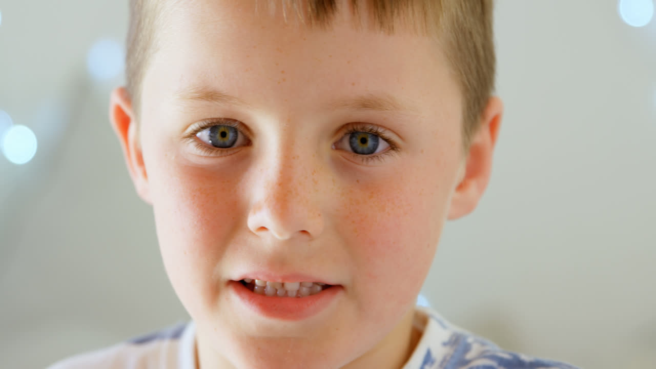 Premium stock video - Boy looking at a camera 4k