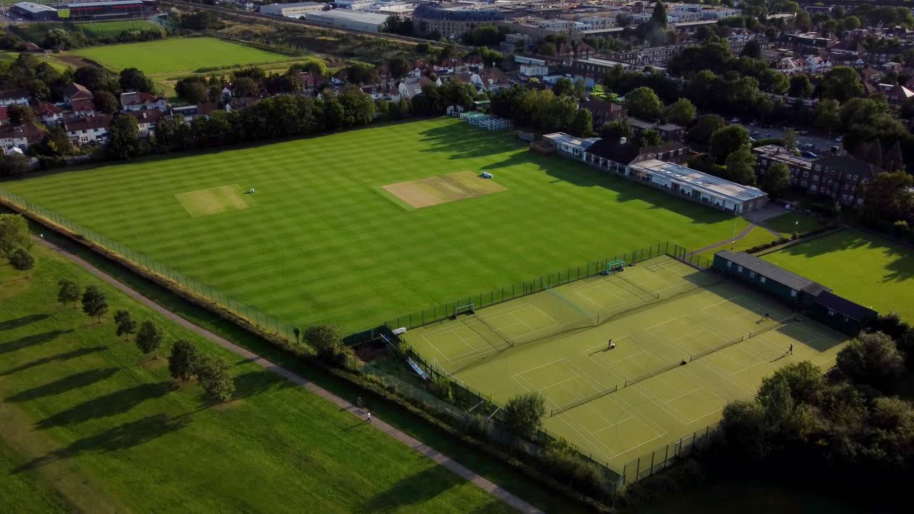 Premium stock video - Cricket pitch and tennis courts