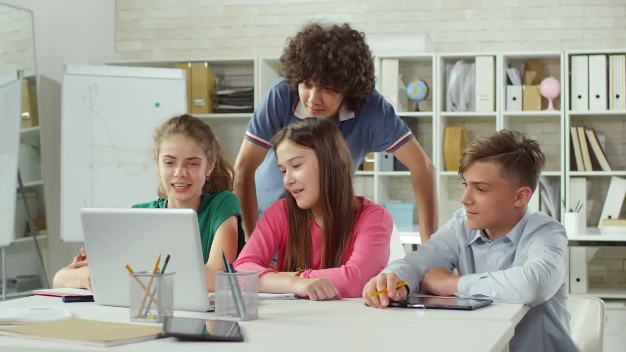 Free stock video - High angle view of classmates gathered around their ...