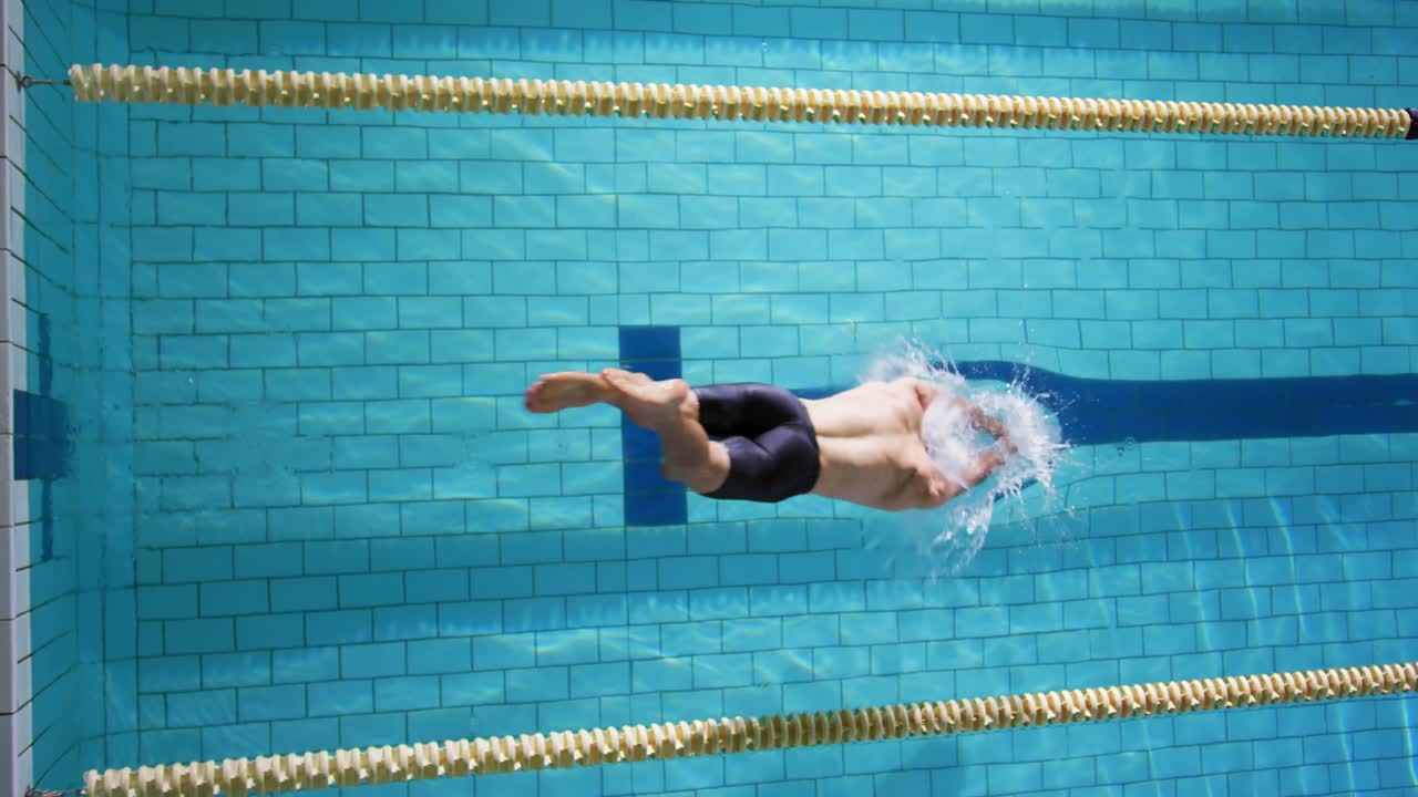 Premium stock video - Swimmer training in a swimming pool