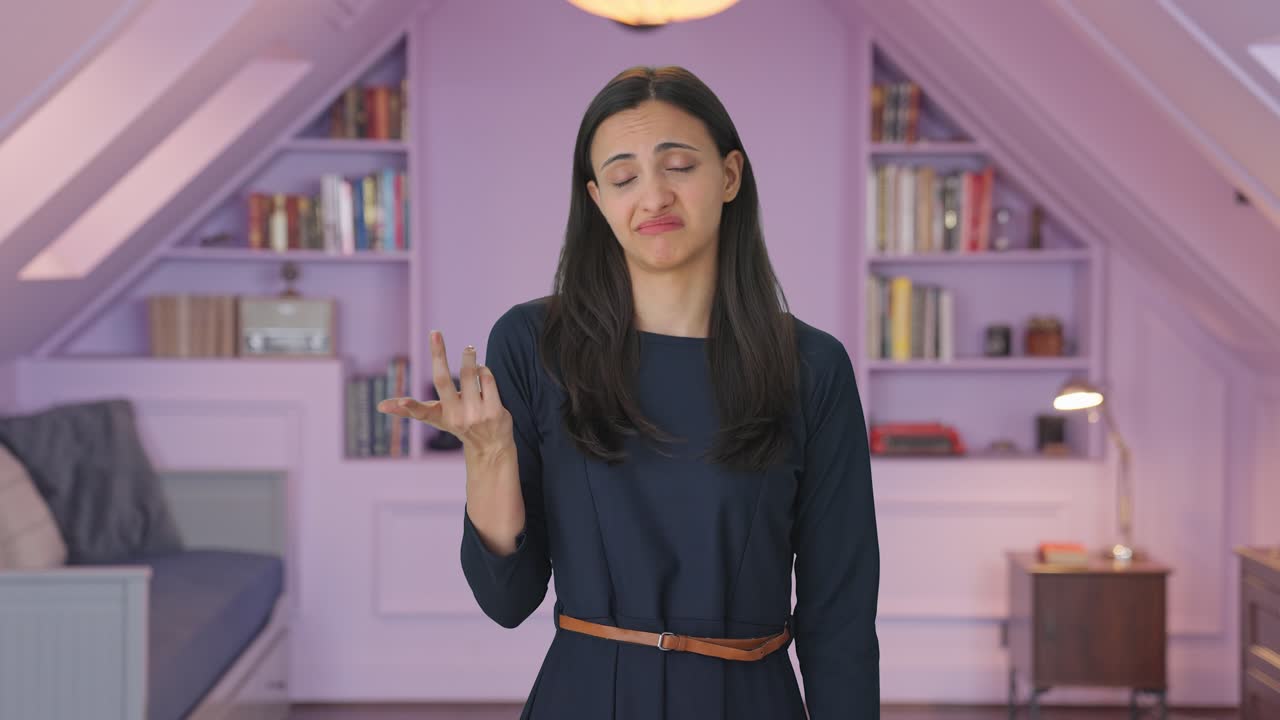 Premium stock video - Confused indian girl asking what questions