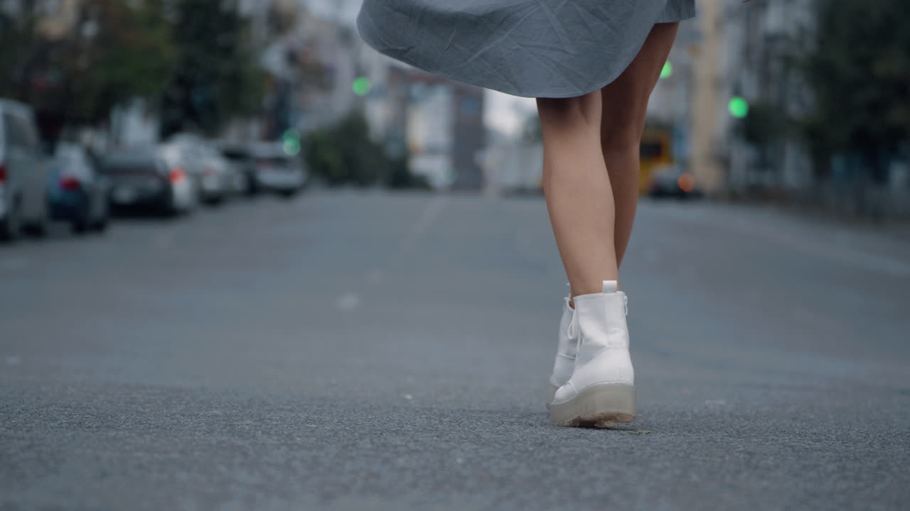 Legs walking down street on highway road. woman taking a walk in city ...