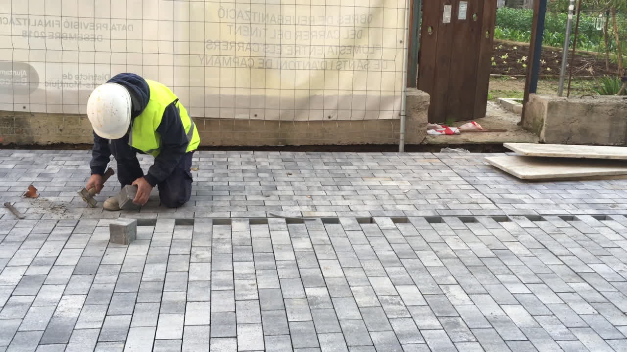 Premium stock video - Public ajuntament de barcelona worker with hammer ...