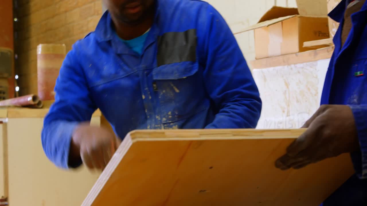 Premium stock video - Workers discussing over metal casting mold in ...