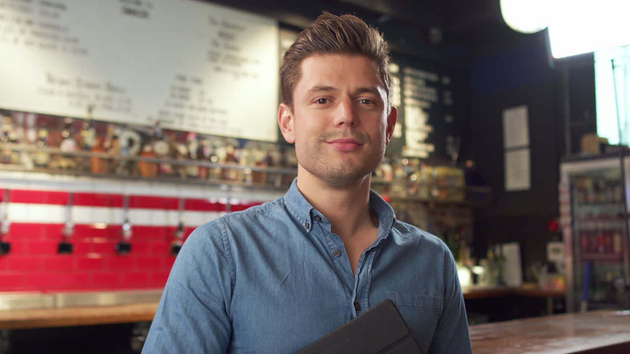 Portrait of male bar owner standing by counter Premium Stock Video Footage