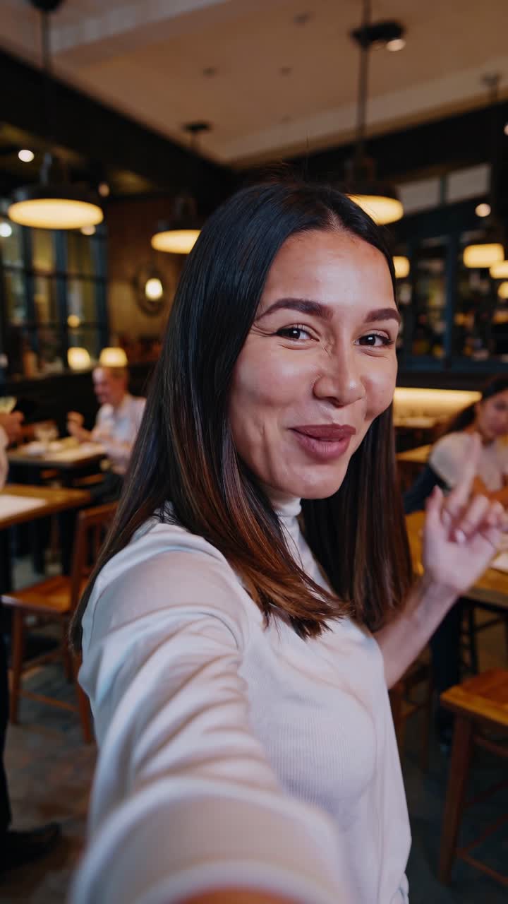 A woman smiling in a cafe, captured in a selfie-style video | Premium ...
