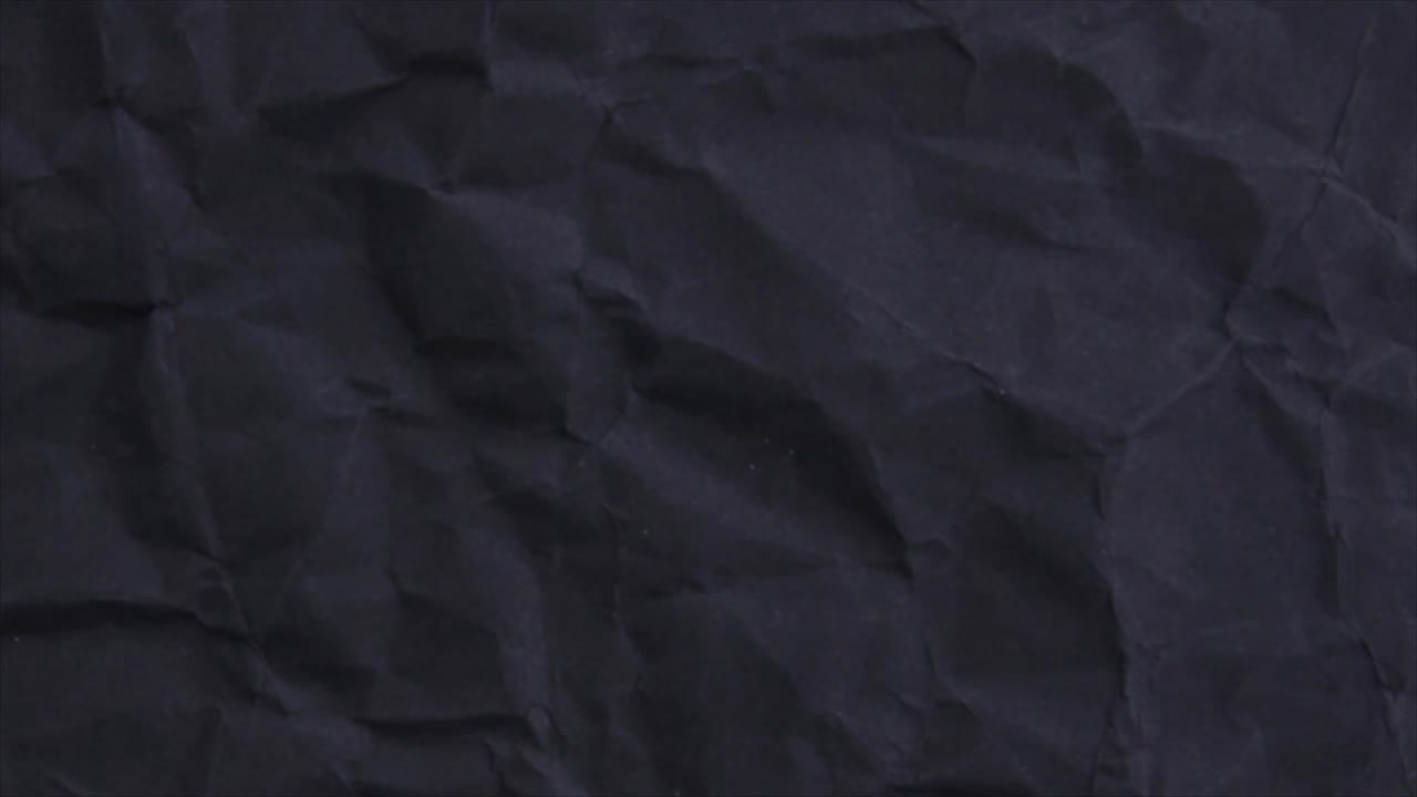 Crumpled Black Paper Texture Background Loop | Premium Stock Video Footage