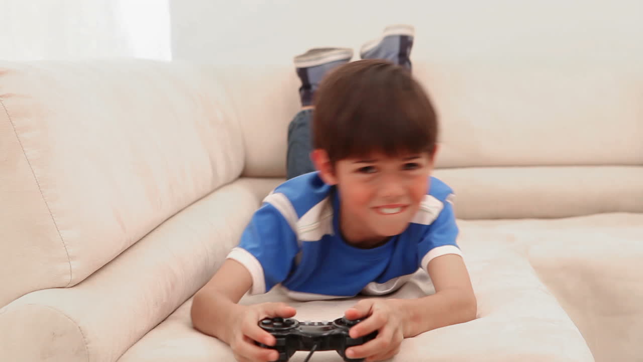 Premium stock video - Boy loses at his video game