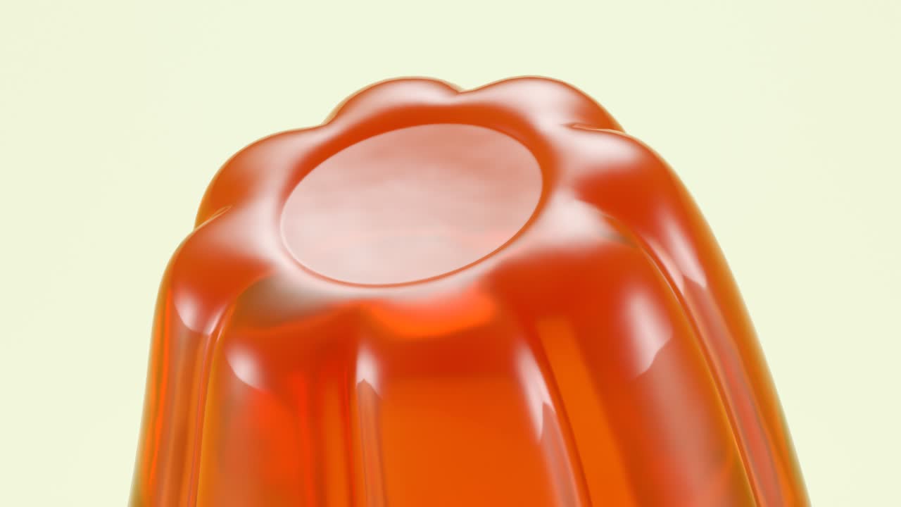 Premium stock video - Wobbly single orange jelly isolated on white ...