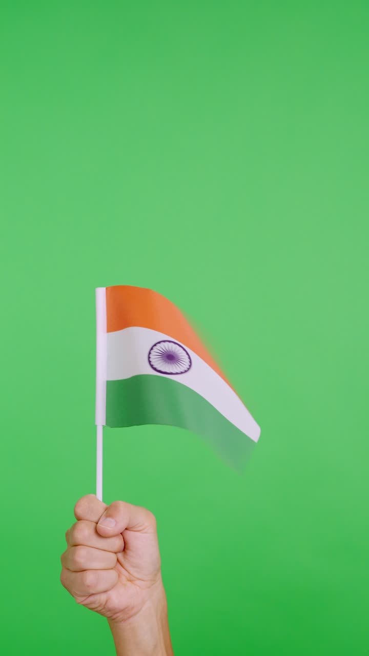 Hand lifting a indian pennant while waving by the wind | Premium Stock ...