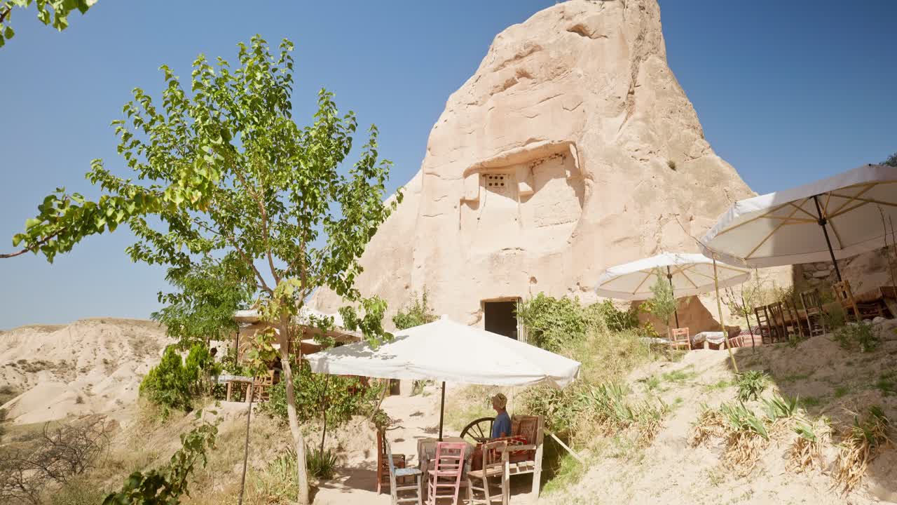 Remote off grid open air cafe hiker rests shade Cappadocia valley trail ...