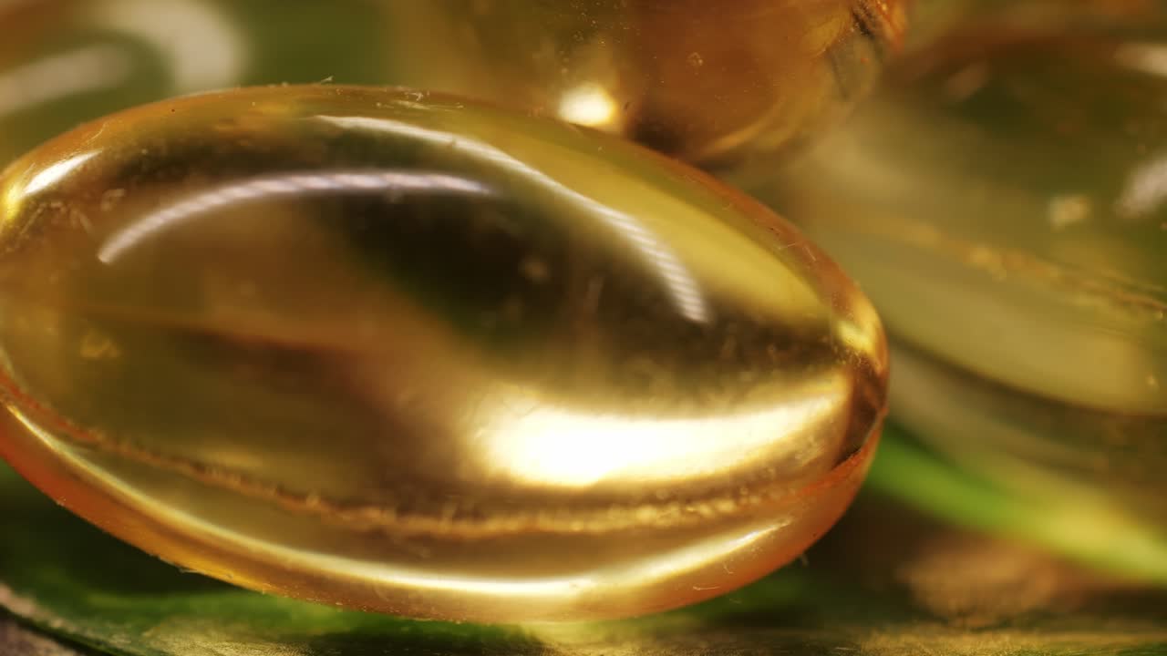 Omega fish oil gel capsules close-up macro . Omega vitamins pills 3 6 9 ...
