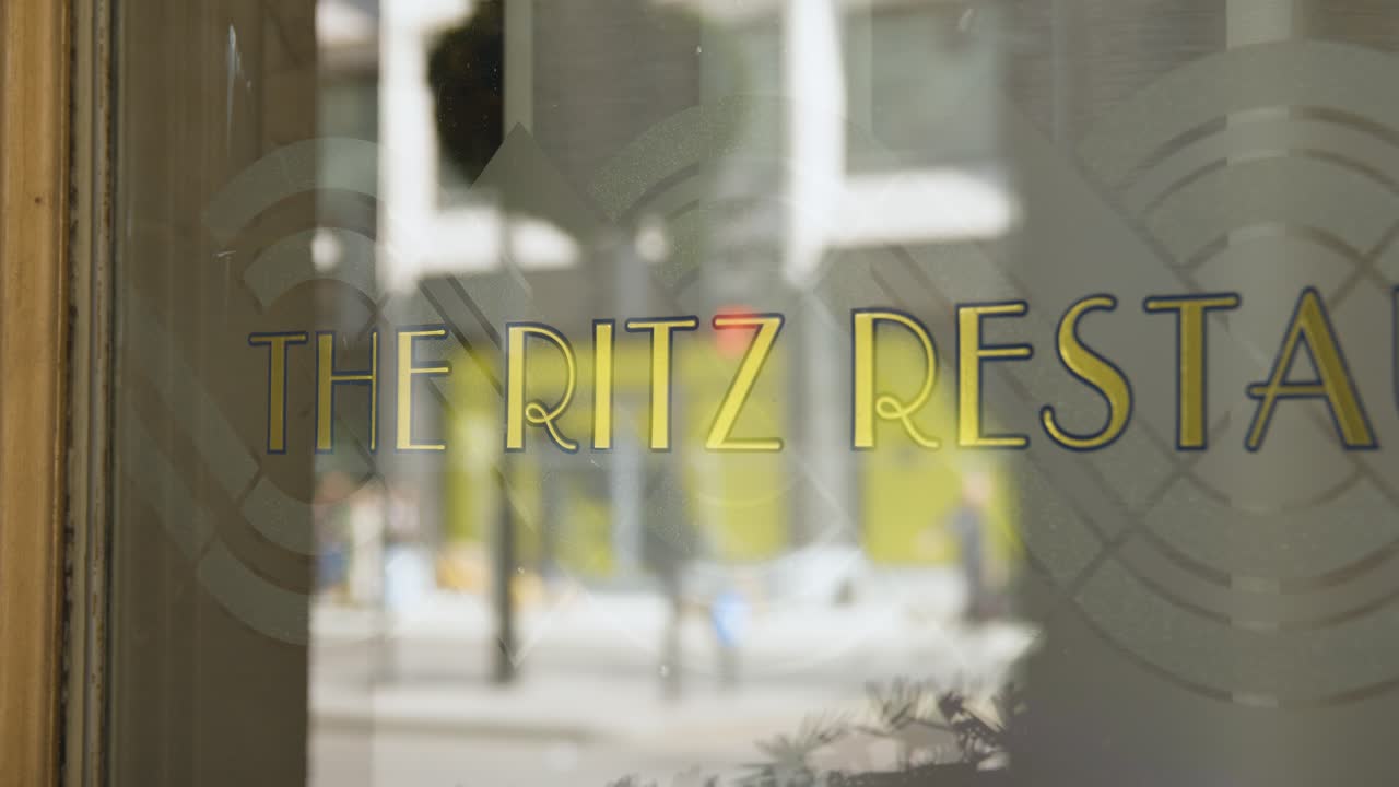 Free stock video - Close up of sign outside the ritz hotel restaurant ...