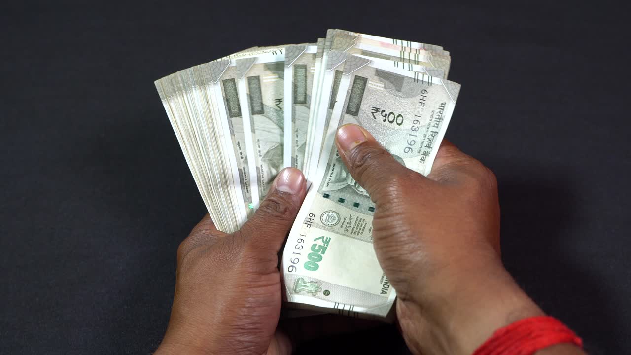 A man counting indian rupees Premium Stock Video Footage
