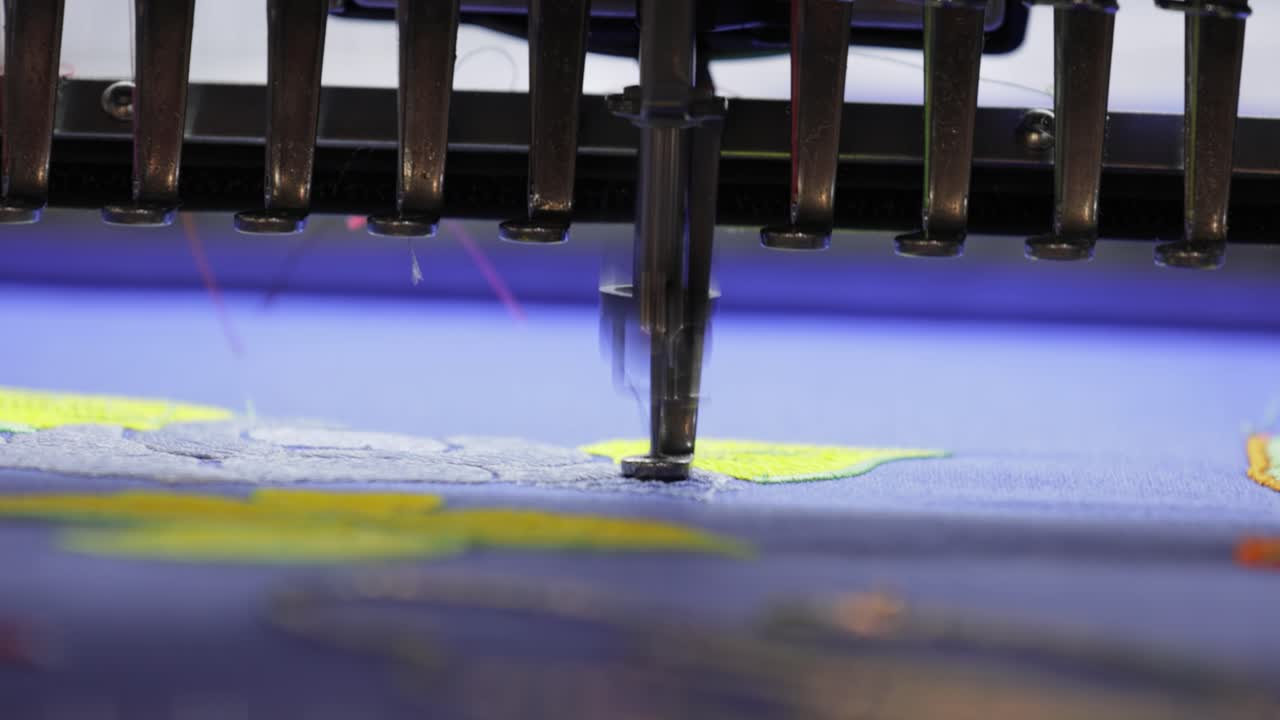 Premium stock video - Automatic industrial sewing machine for stitch by ...