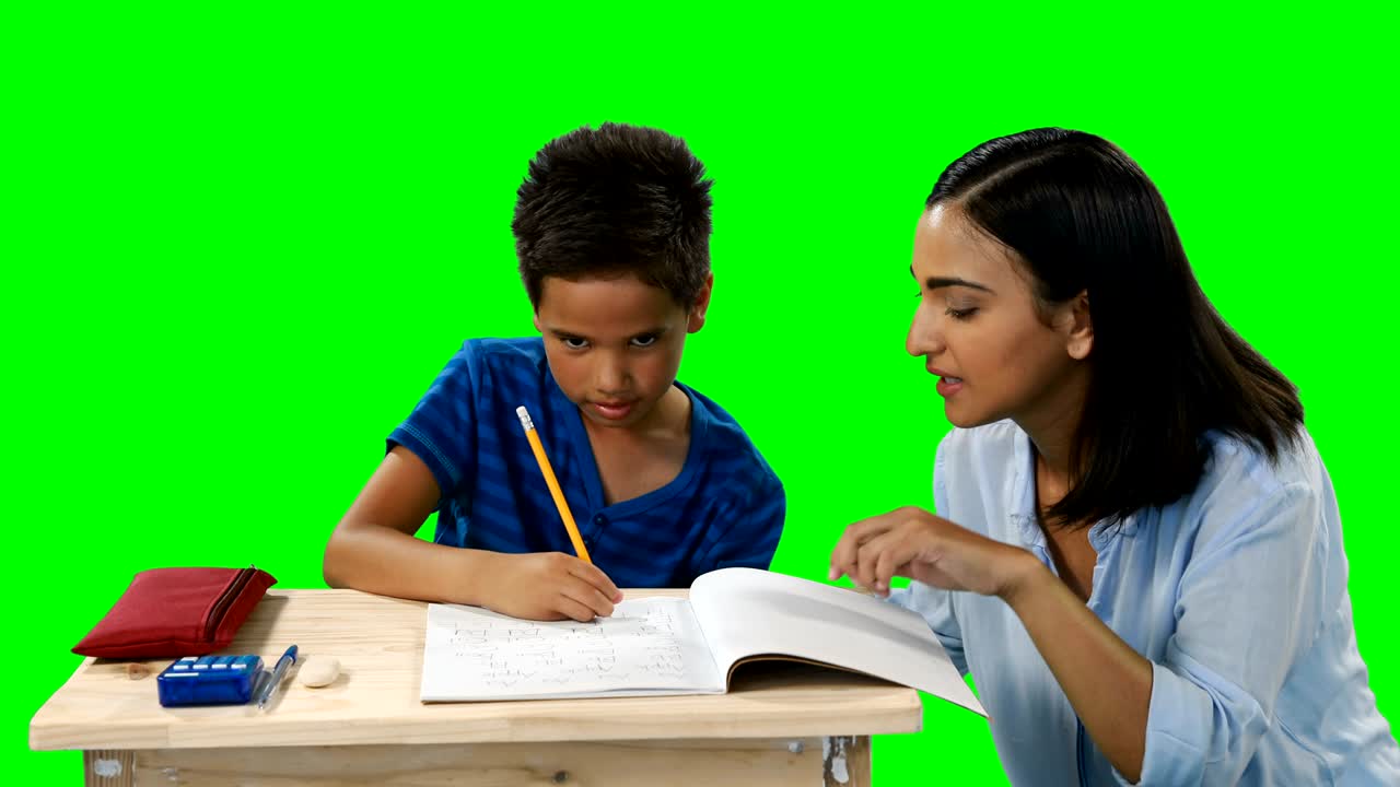 Mother helping her son while doing homework 4k | Premium Stock Video ...