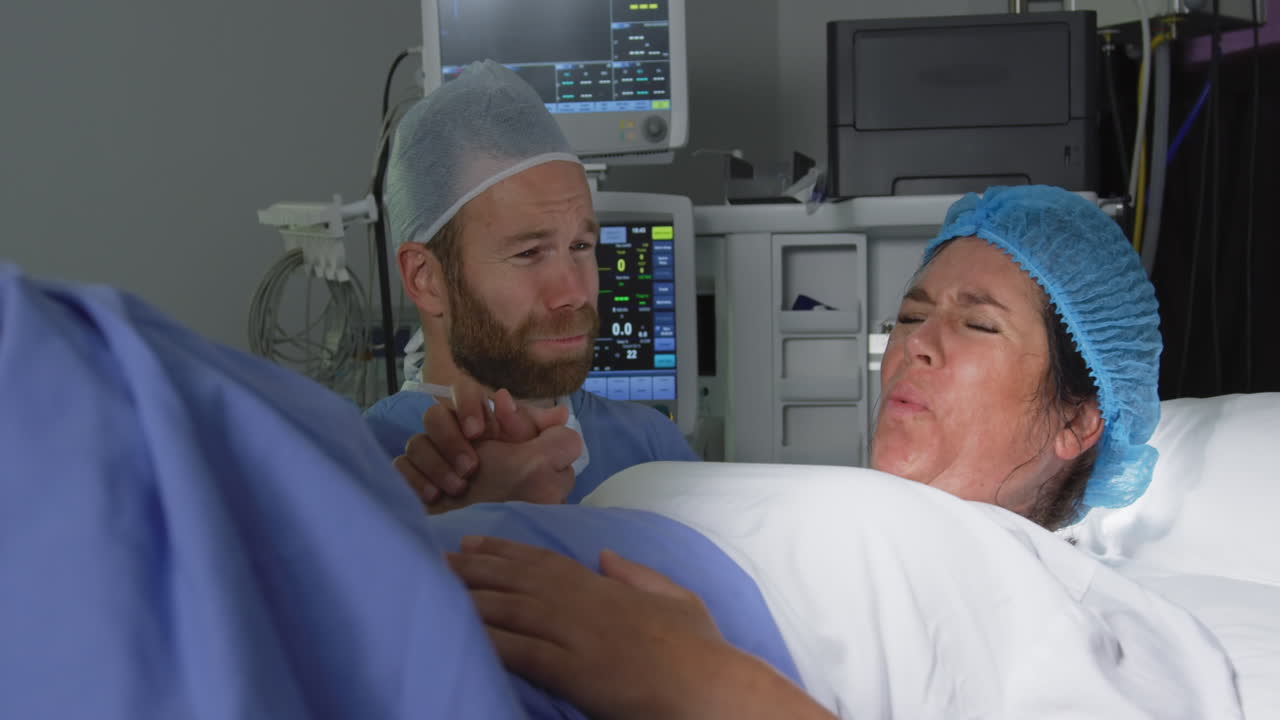 Premium stock video - Front view of caucasian man comforting pregnant ...