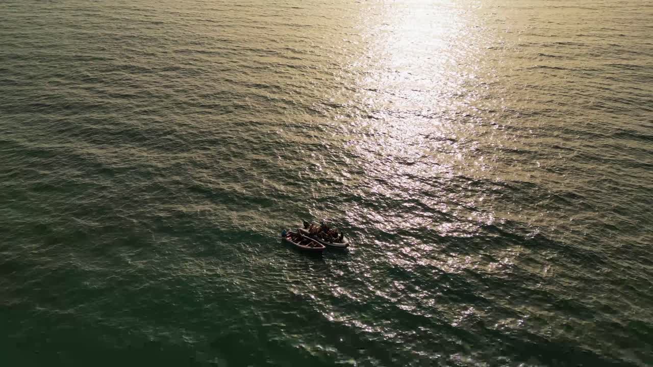 Premium stock video - Divers on floating scuba diving boats during dusk ...