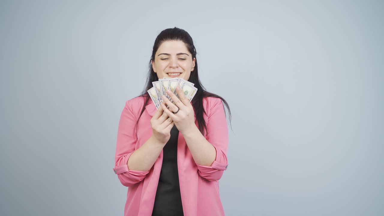 Premium stock video - Business woman who loves money.