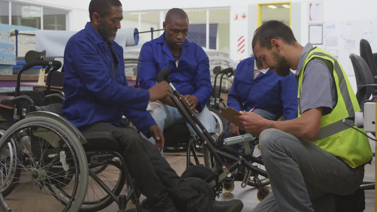 Workers with disabled man working | Free Stock Video Footage