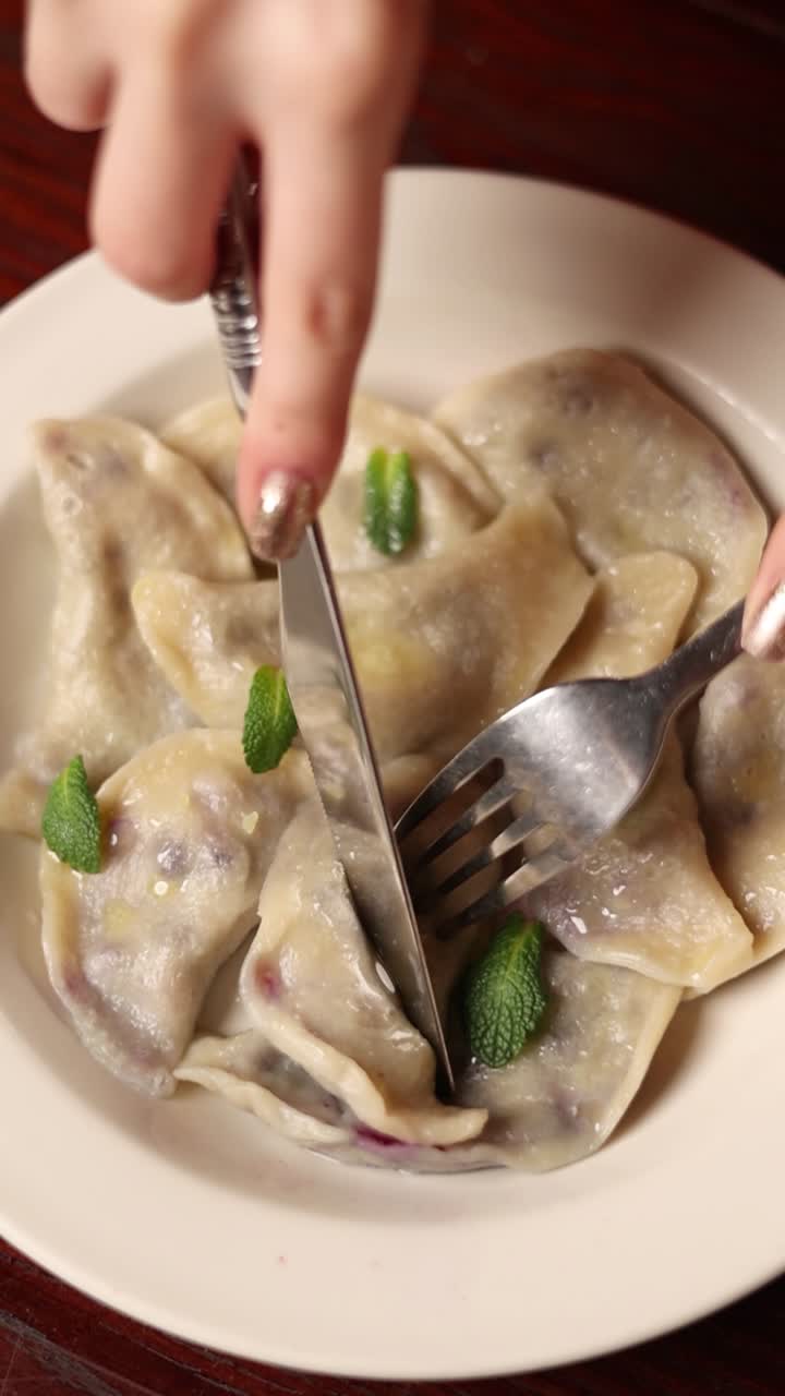 Eating Pierogi with blueberries | Premium Stock Video Footage