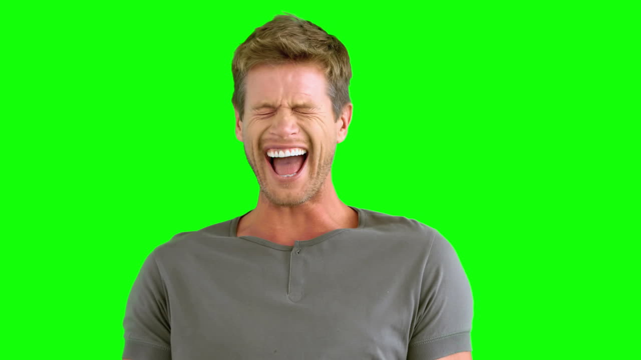 Man laughing on green screen | Premium Stock Video Footage