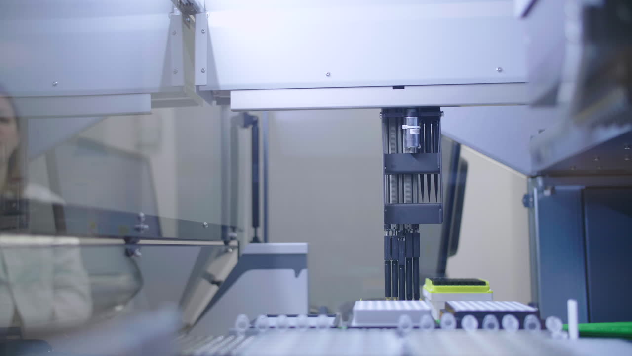 Automated Pipetting System In Action In A Laboratory. France Free Stock Video Footage Download Clips