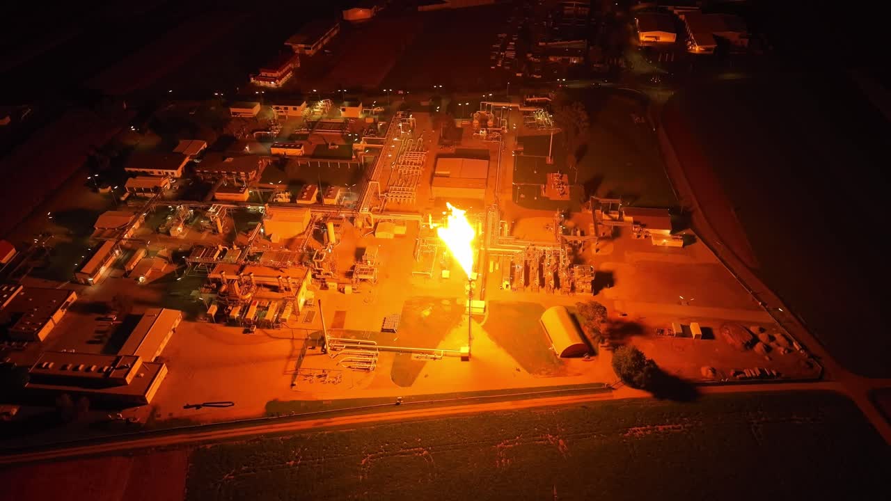 The Entire Facility Is Bathed In Light As Gas Flaring Occurs - Drone ...