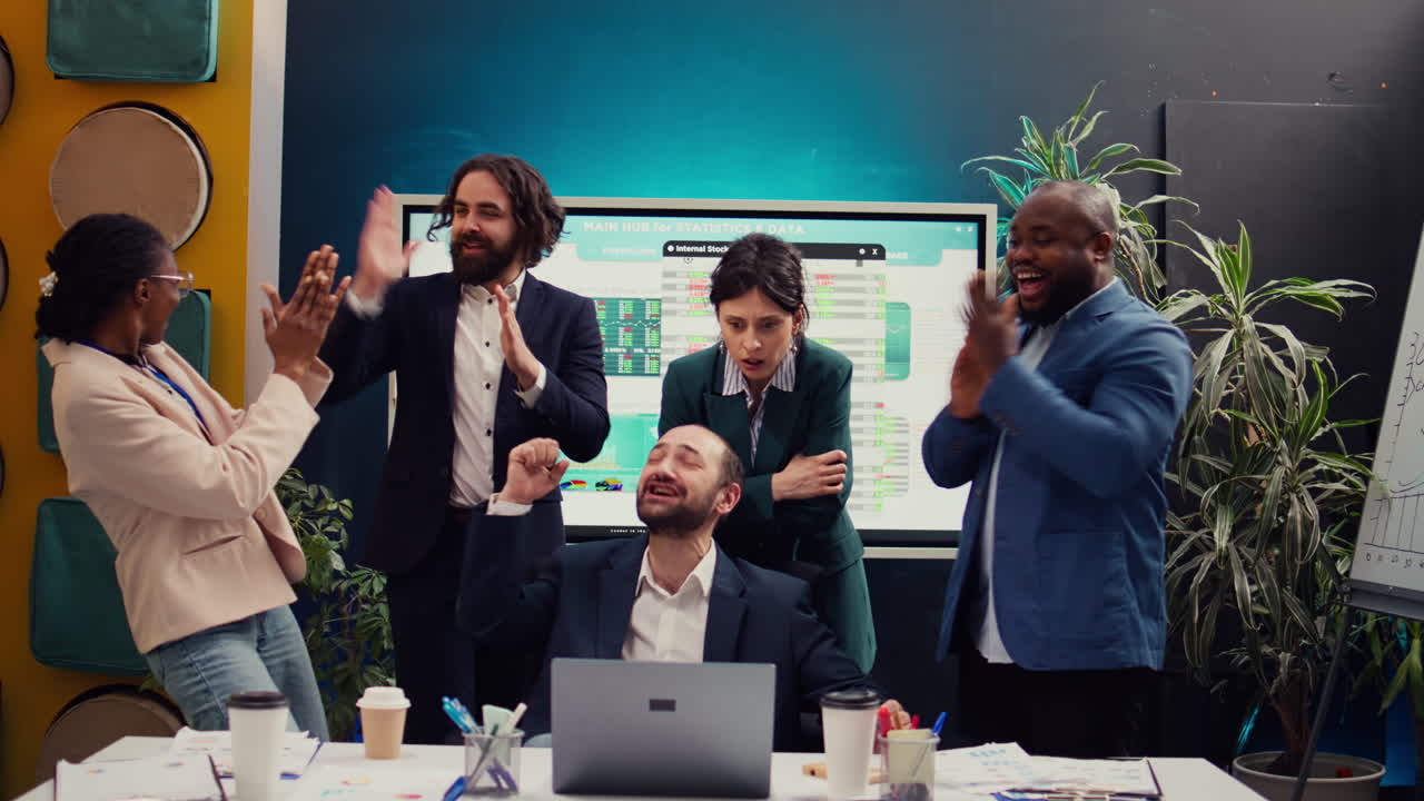 Premium stock video - Joyful proud employees celebrating their business ...