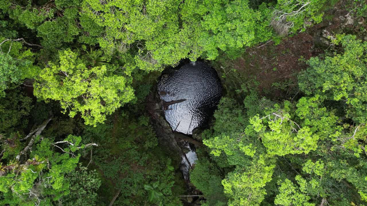 Water Trickling Into A Naturally Formed Sinkhole Hidden Deep Amongst A ...