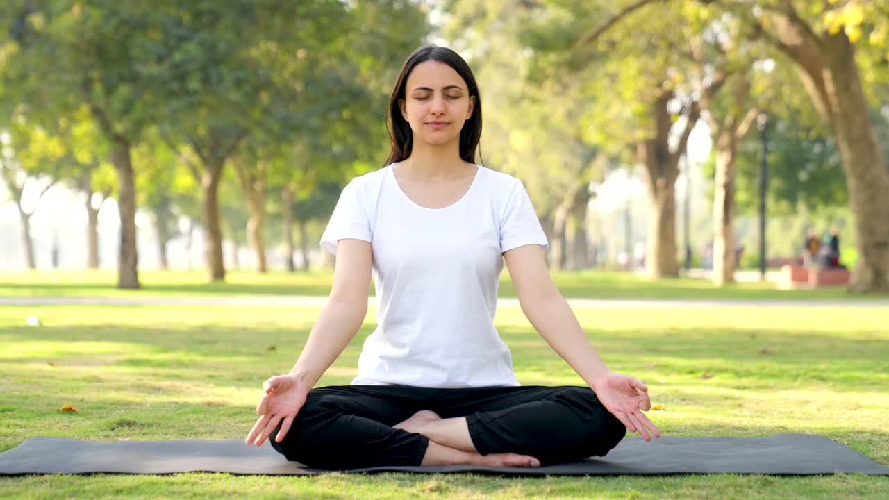 Premium stock video - Indian girl meditation and taking long breaths in ...
