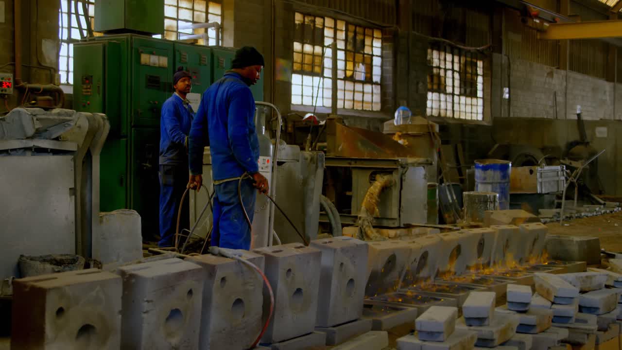 Male worker heating molds in workshop 4k Premium Stock Video Footage