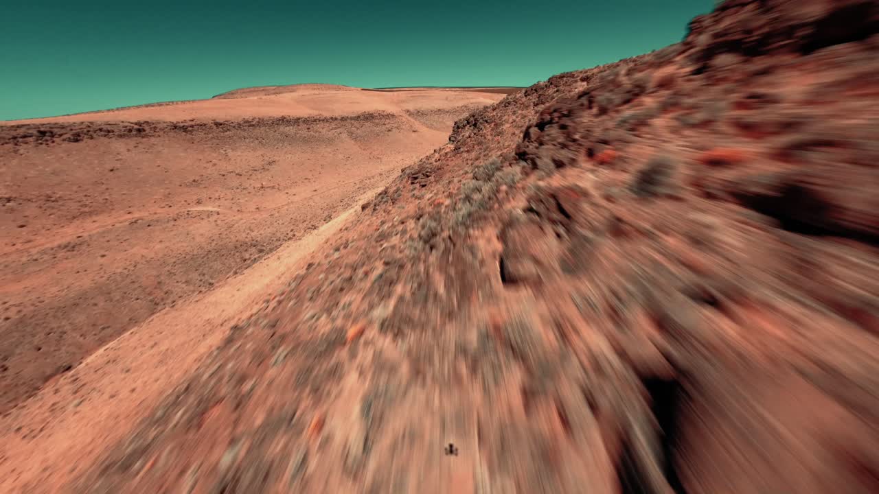 Fpv racing drone flying dangerous with high speed near rocks and low to ...