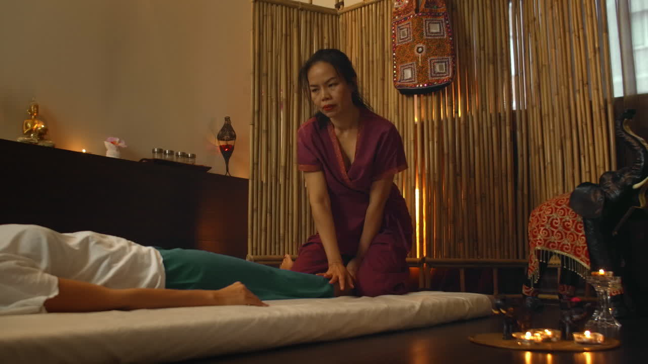 Alternative Chinese medicine an Asian woman performs therapeutic ...
