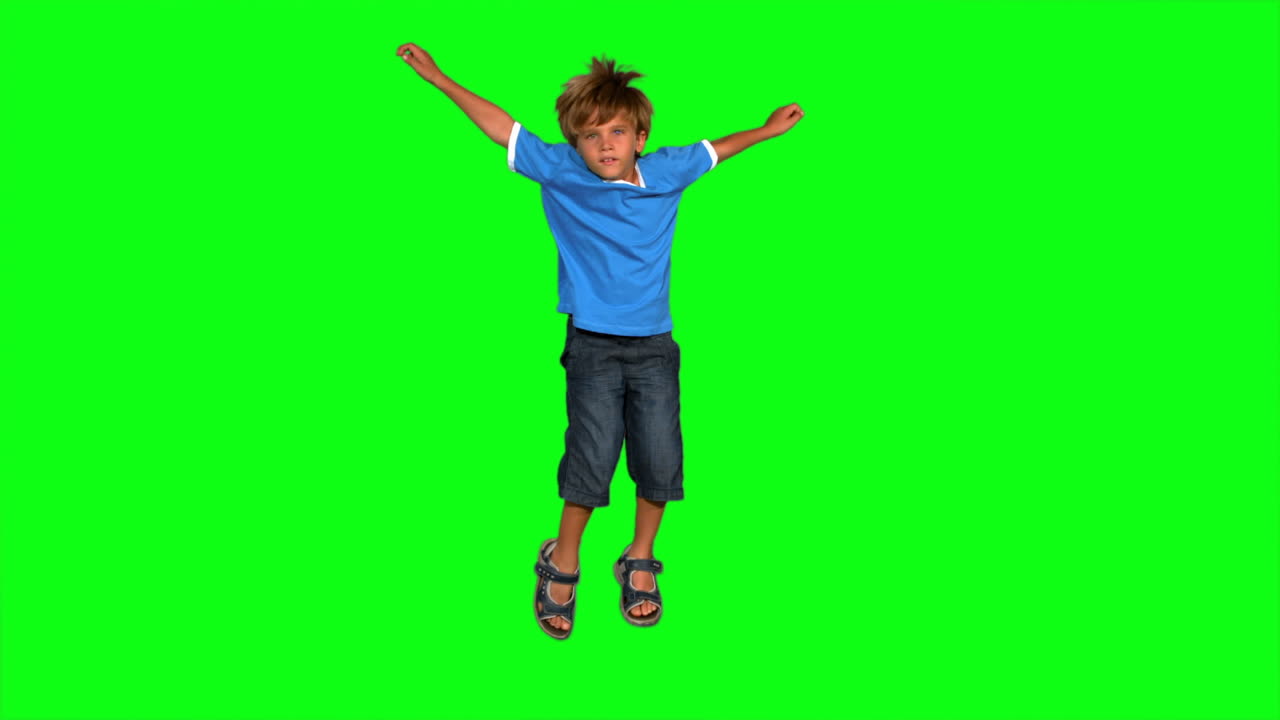 Boy jumping on green screen Free Stock Video Footage