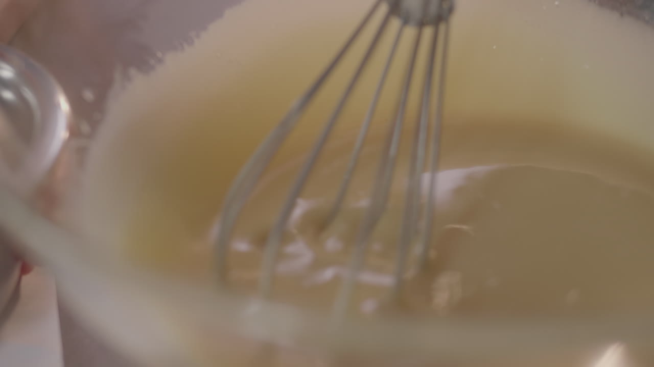 Premium stock video - Whisking cake or pie batter