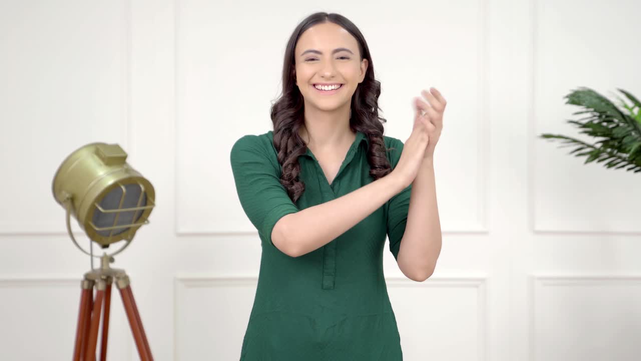 Premium stock video - Indian girl clapping and cheering