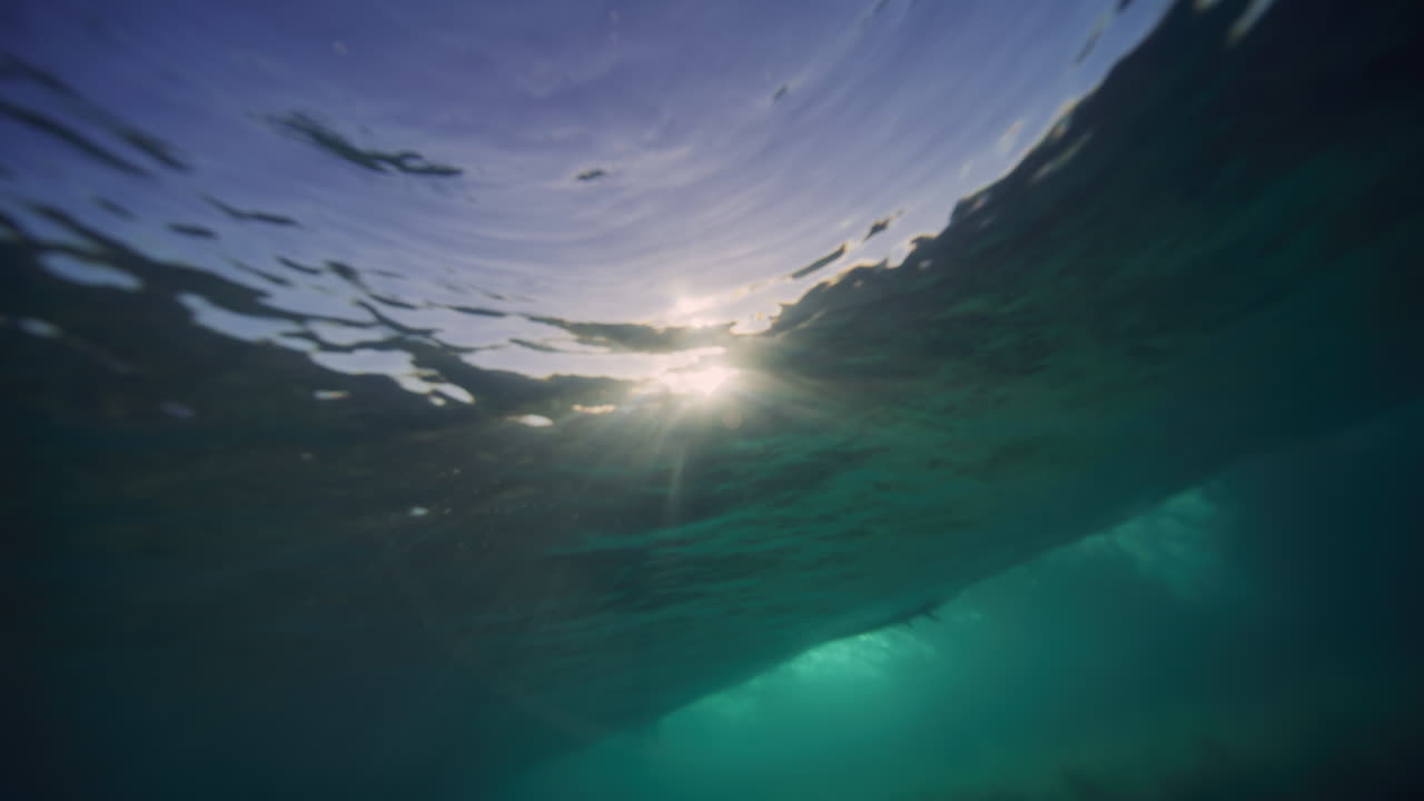 Free stock video - Low underwater view of light sparkling across ocean ...
