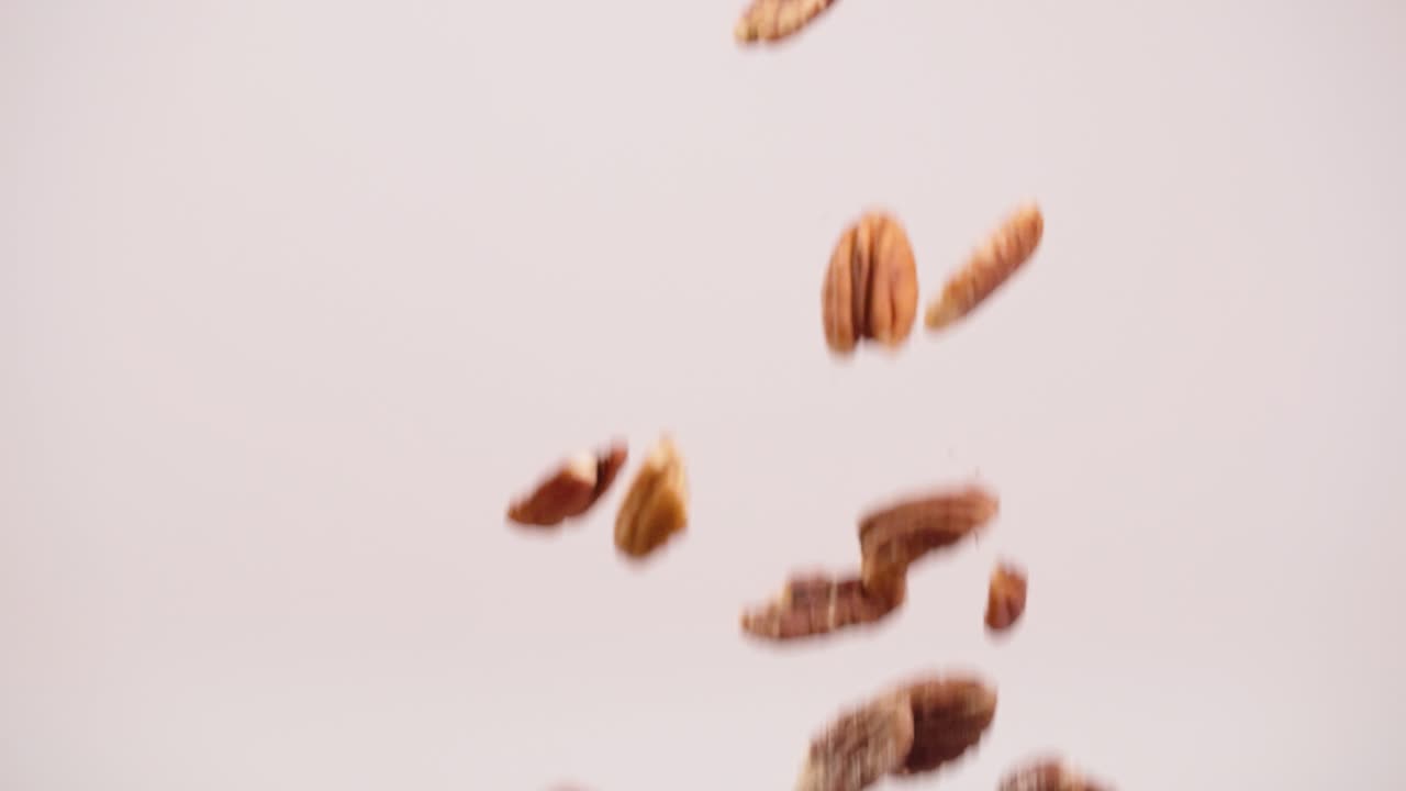 Pecans falling in slow motion | Premium Stock Video Footage