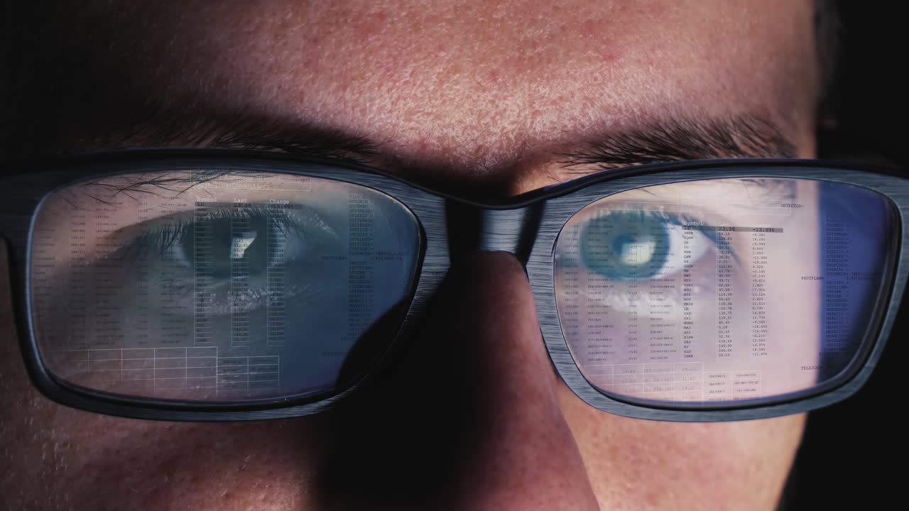 Man Works On Computer Screen, Which Is Reflected On His Glasses - Code, Numbers, Network - Close ...