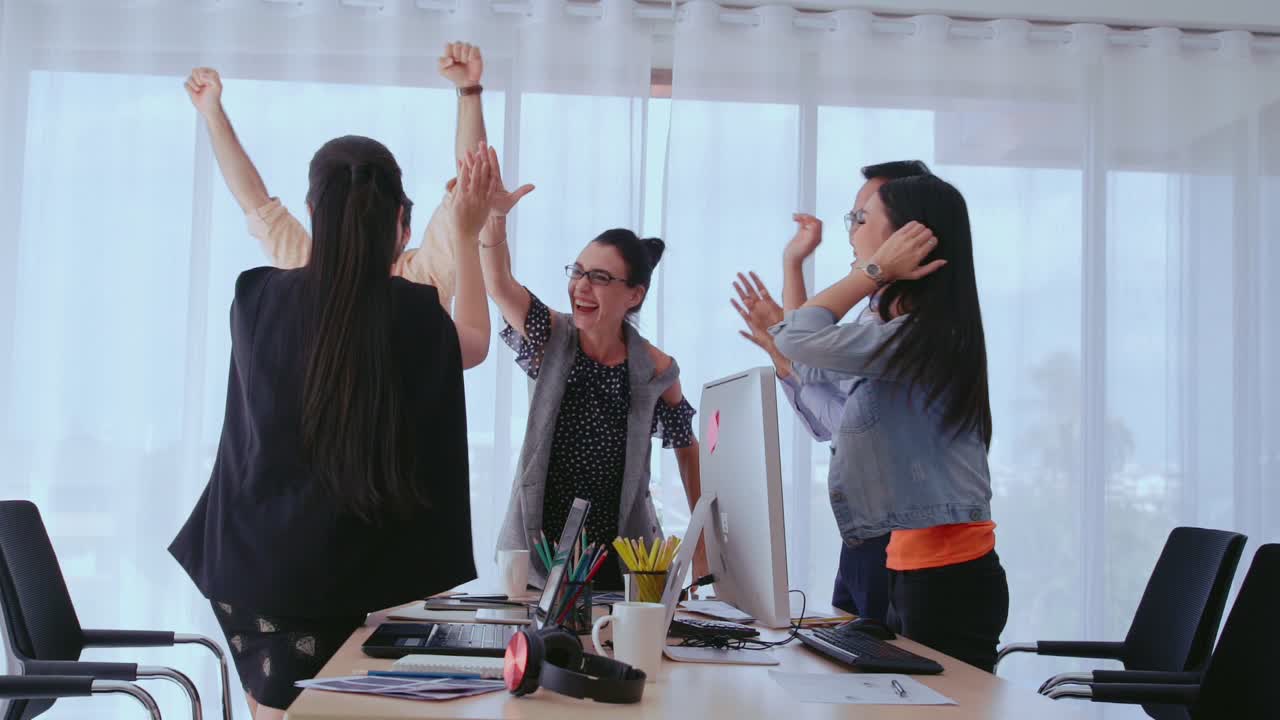 Premium stock video - Successful business people celebrating project ...