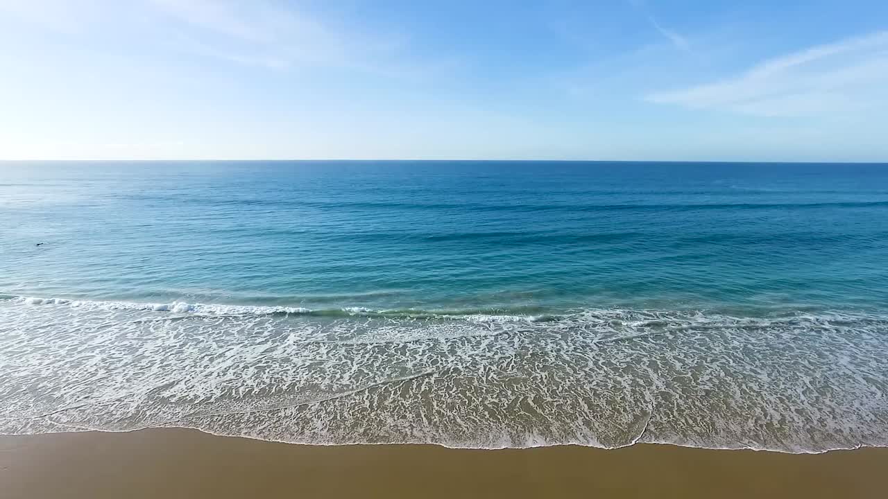 Cool ocean waves washing against spanish beach golden sandy beachfront ...