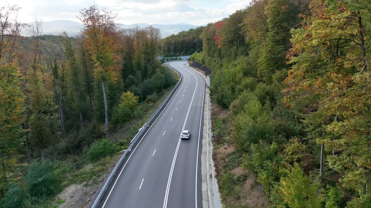 Premium stock video - Mavic drone chasing a car with active track