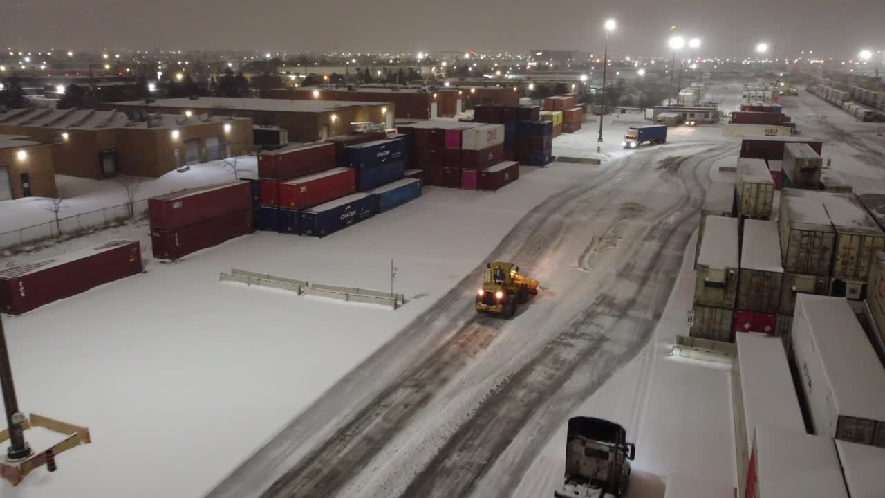 Warehouse Snow Removal: Snow Plow Clears The Road For Shipping ...