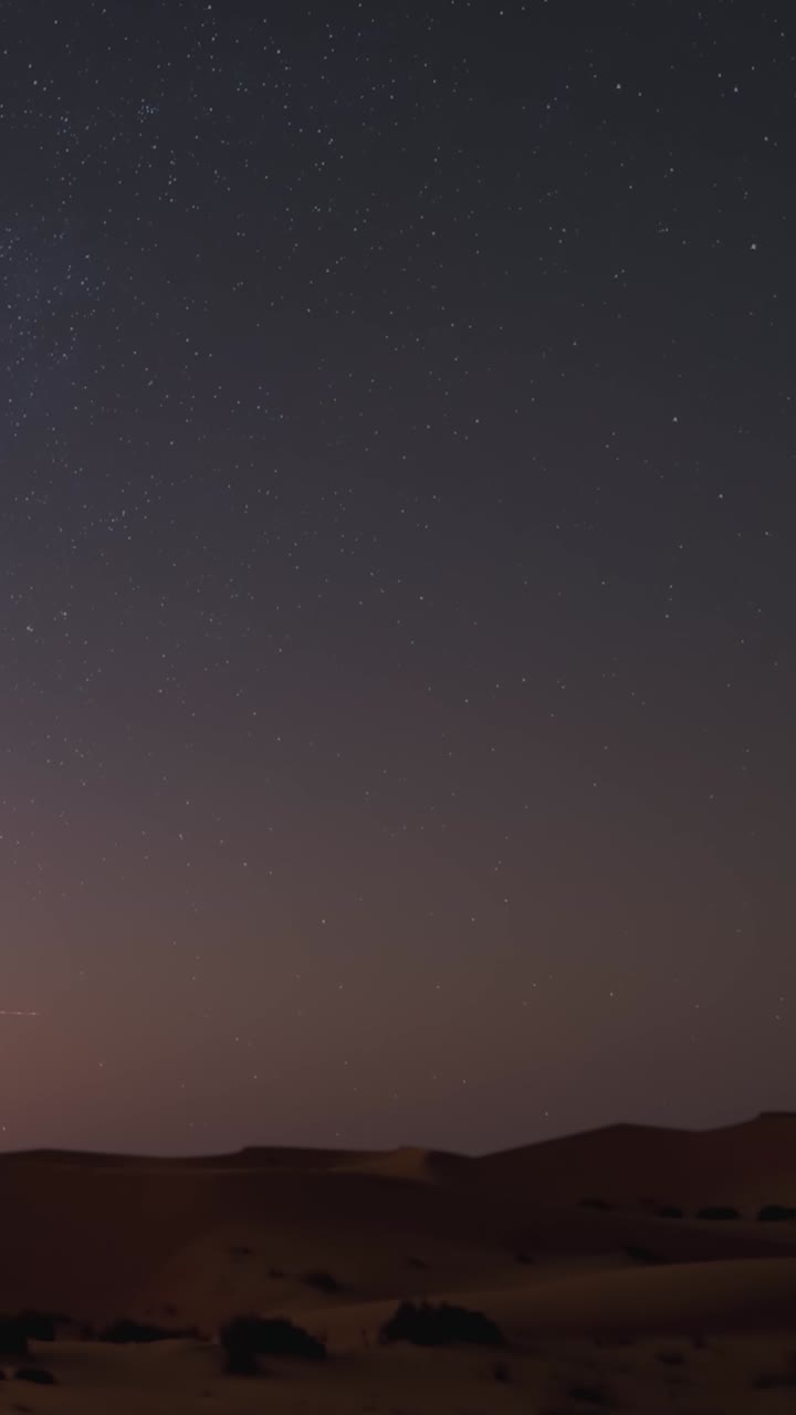 Sunset to Milky Way vertical time lapse over the sand dunes in the Al ...